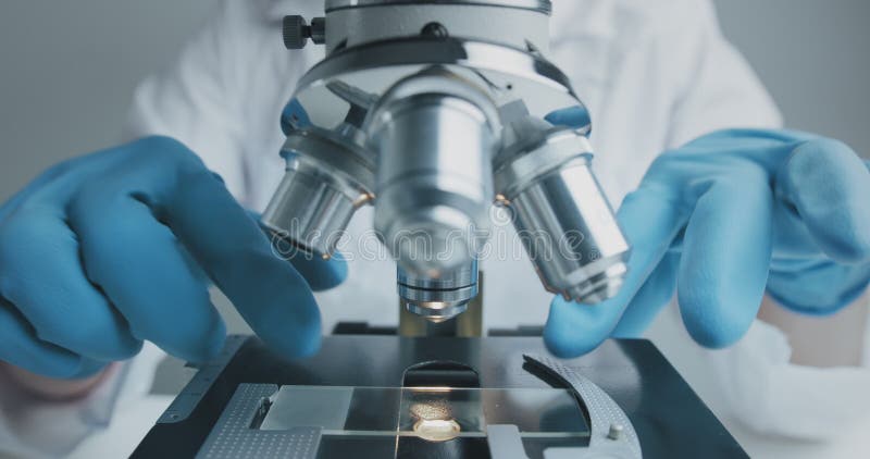Close Up of Examining of Test Sample of Microchip Transistor Under the ...