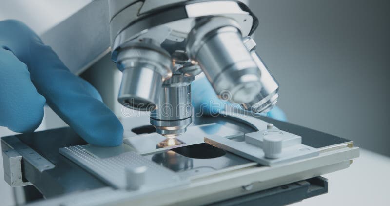 Close Up of Examining of Test Sample of Microchip Transistor Under the ...