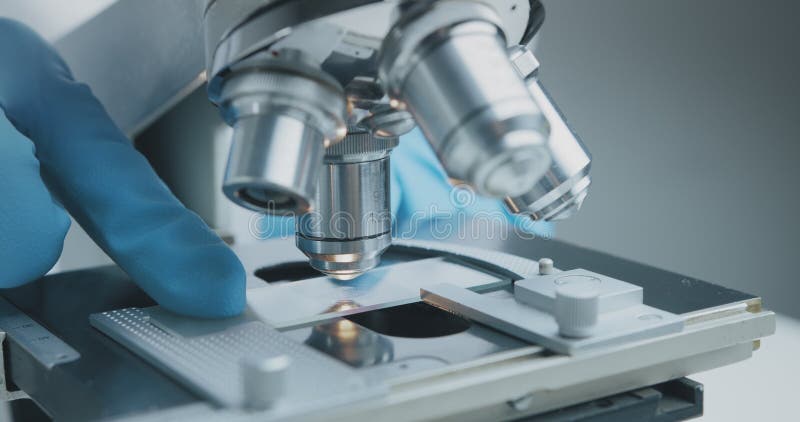 Close Up of Examining of Test Sample of Microchip Transistor Under the ...