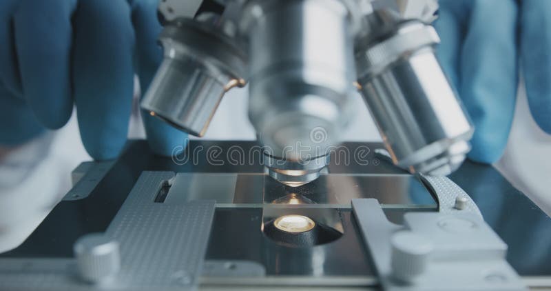 Close Up of Examining of Test Sample of Microchip Transistor Under the ...