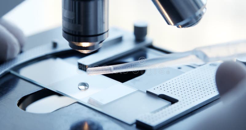 Close Up of Examining of Test Sample of Microchip Transistor Under the ...