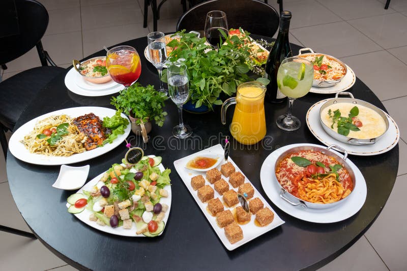 Close-up Shot of a Served Table with Different Dishes Stock Photo ...