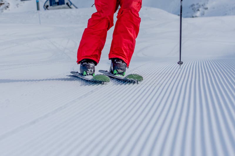 Shot of a Skier Standing on Top of a Mountain with Skis on His Shoulder ...