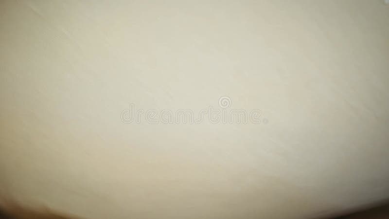 A Close-up Shot of a Soft, Beige Fabric with a Subtle Textured Pattern ...