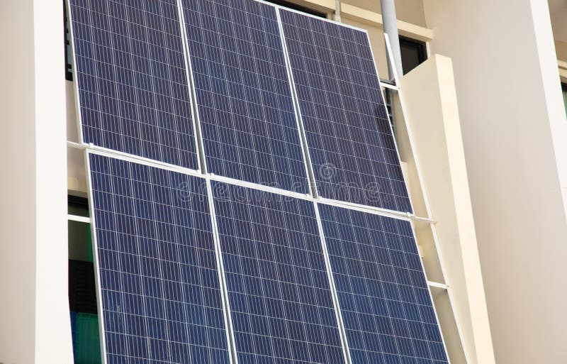Close Up Shot of Solar Cell Panel System Vertically Placed on the House ...