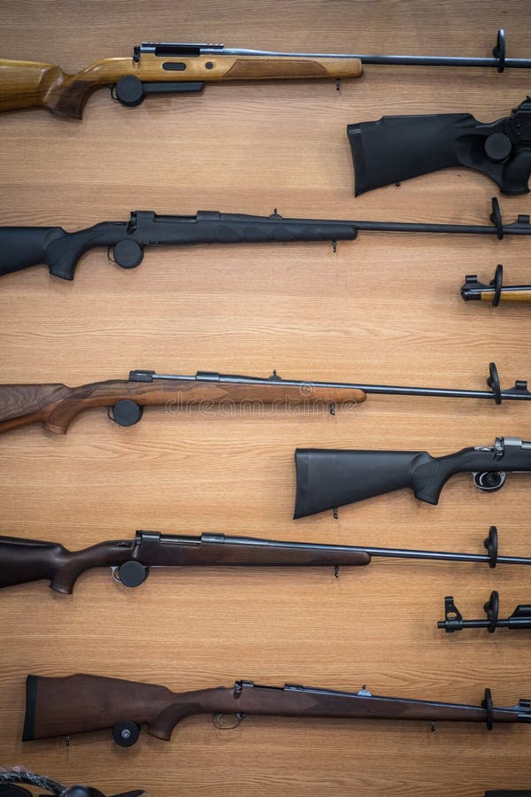 Rifles on a wall stock photo. Image of hunting, firearm - 144298182