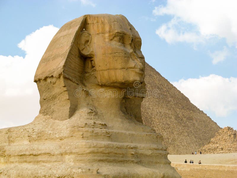 Close-up Shot of the Sphinx Statue with the Pyramid of Giza in the ...