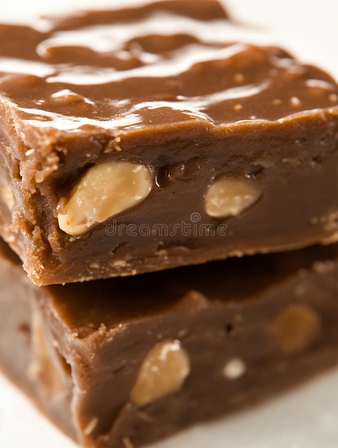Close Up Shot of a Stack of Chocolate Fudge with Peanuts on a White ...