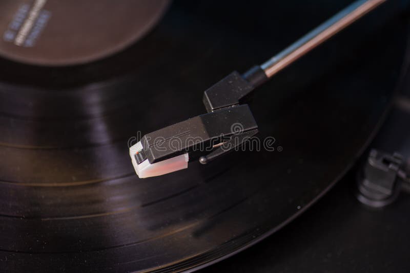 Close Up Shot on Turntable Arm Hovering Above Record Stock Image ...