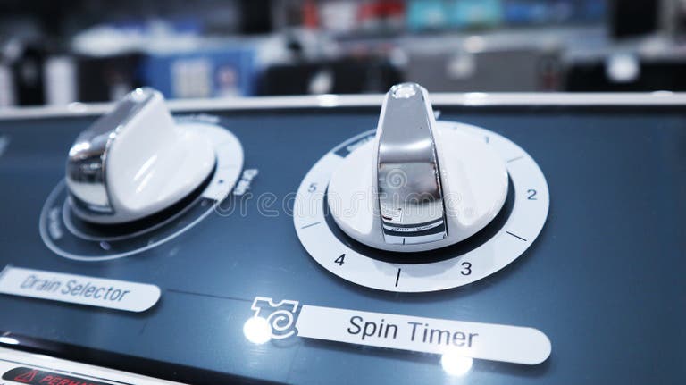 A Close-up Shot of Two Control Knobs on a Washing Machine Stock Photo ...