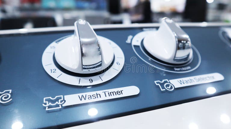 A Close-up Shot of Two Control Knobs on a Washing Machine Stock Image ...