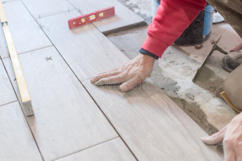 Close Up Shot of Unfinished Floor Tiles Installation in Kitchen Stock ...