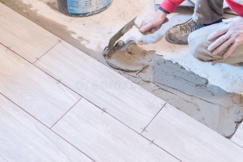 Close Up Shot of Unfinished Floor Tiles Installation in Kitchen ...