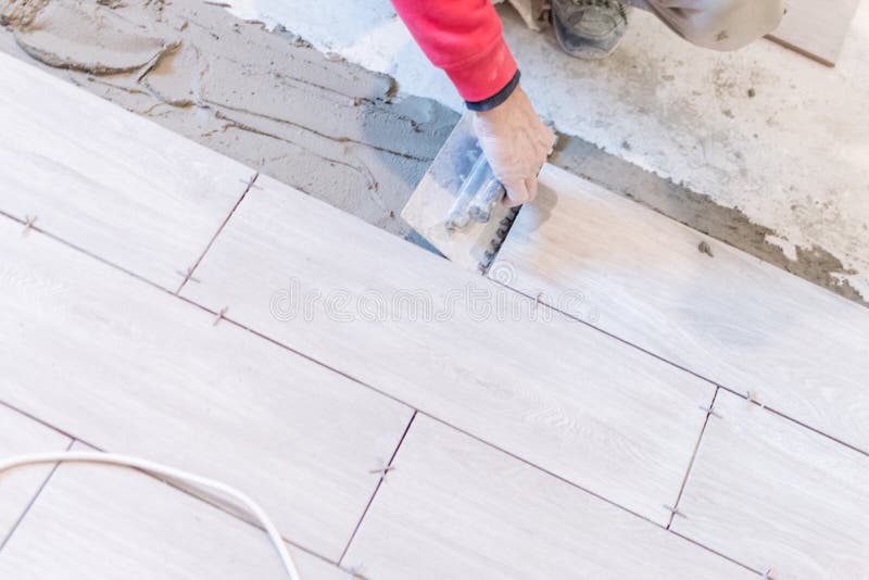 Close Up Shot of Unfinished Floor Tiles Installation in Kitchen Stock ...