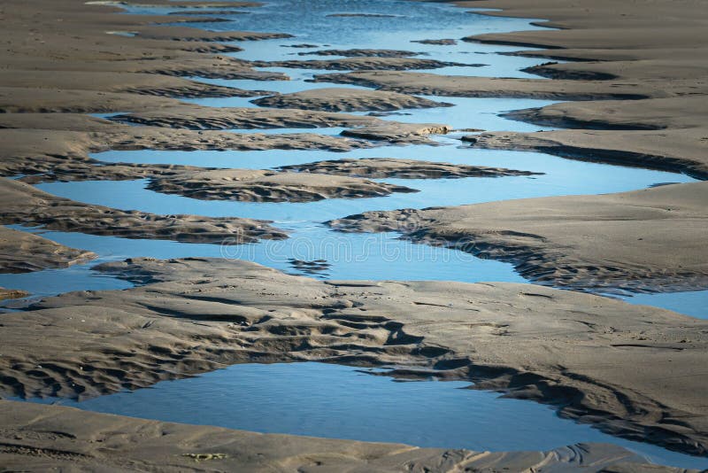 Close Up Shot of Water and Sand Patterns on Beach Stock Photo - Image ...