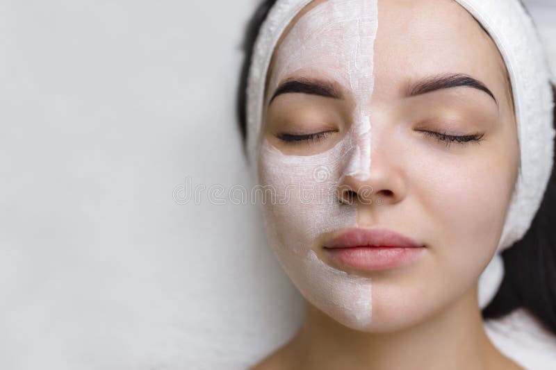 Close Up Shot Of A Woman Getting Facial Treatment With Clay Mask