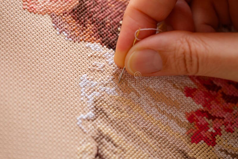 Close-up Shot of a Woman Hand Doing a Cross Stitch Stock Image - Image ...