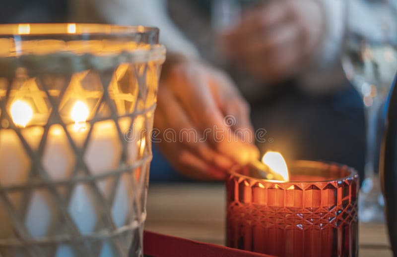 Close-up Shot of a Woman`s Hand Lighting Candle Using Matches Stock ...