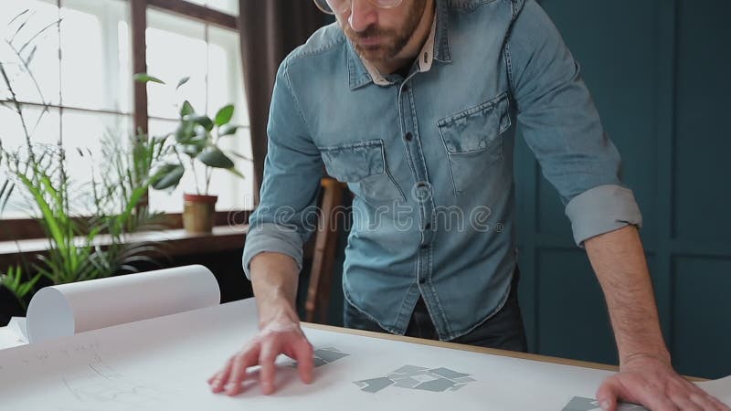 Close Up Shot of Young Man Hands Engineer Opening the Paper and ...