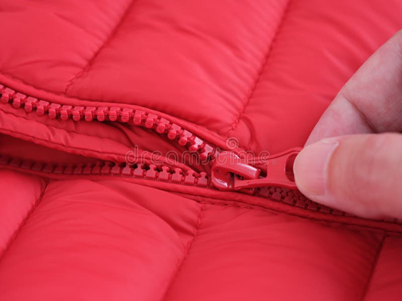 Close-up Shot of a Zipper on a Red Jacket. Hand Unzipping a Red Jacket ...