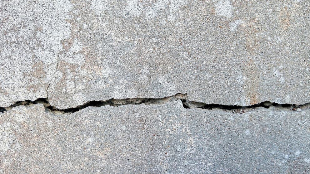 Close Up Shows Horizontal Cracks on the Surface of the Building& X27;s Concrete Wall. Stock ...