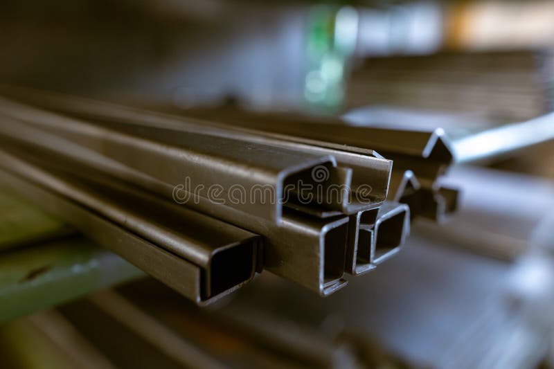 A Close-up Shows a Stack of C-shaped Metal Profiles Organized on a ...