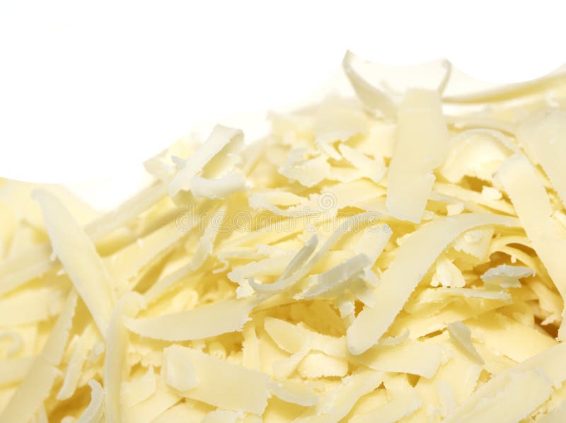 Close Up of Grated Cheddar Cheese Falling and Piling Up on White ...
