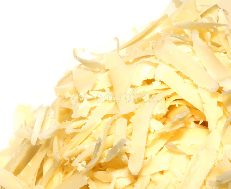 Close Up of Grated Cheddar Cheese Falling and Piling Up on White ...
