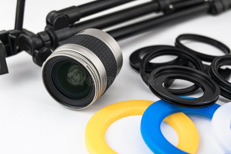 Shutter of a Photo Camera Lens, with Small Tripod and Adapter Rings on ...
