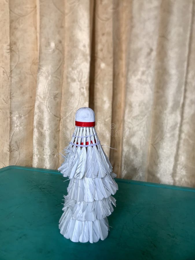 Close Up of the Shuttlecock Isolated on Blue and Yellow Background ...