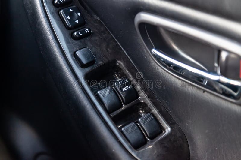 Close-up of the Side Door Buttons: Window Adjustment Buttons, Door Lock ... Close-up of the Side Door Buttons: Window Adjustment Buttons, Door Lock ...