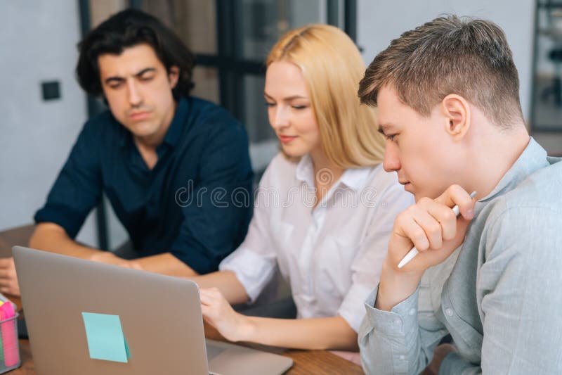 Close-up Side View of Female Team Leader and Employees Working Together ...