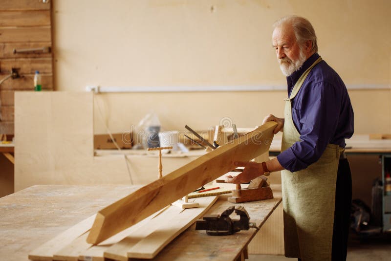 Close Up Side View Image of Old Man Checking Wooden Plank for Building ...