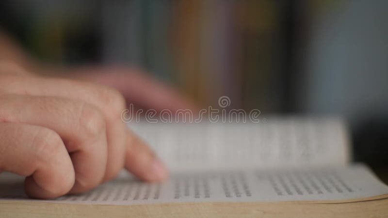 Side View of a Person Hand Touching Page when Reading a Book Stock ...