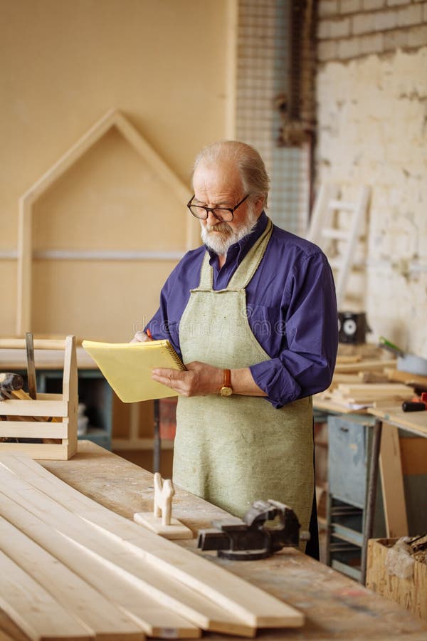 Close Up Side View Shot of Standing Retiree Reading Information from ...
