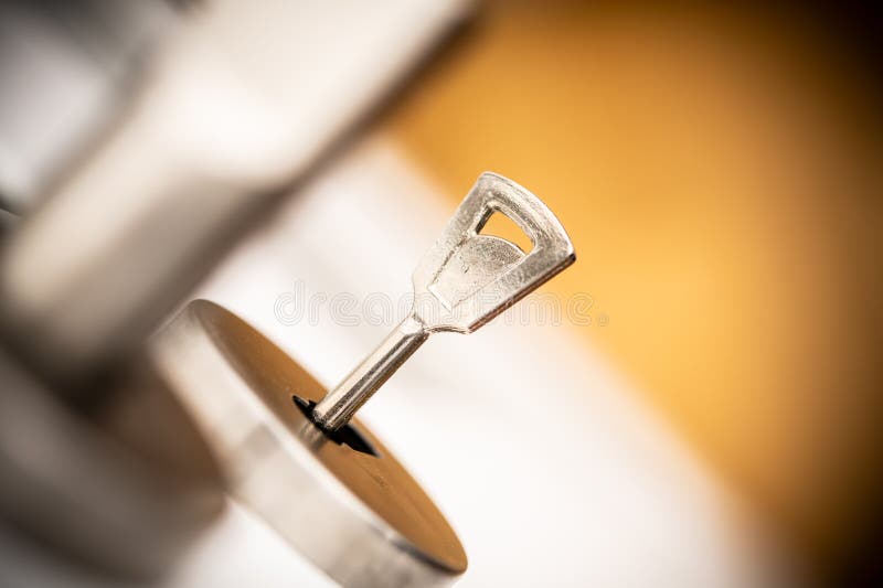 Close-up of a Silver Key Inserted into a Lock, Symbolizing Security and ...