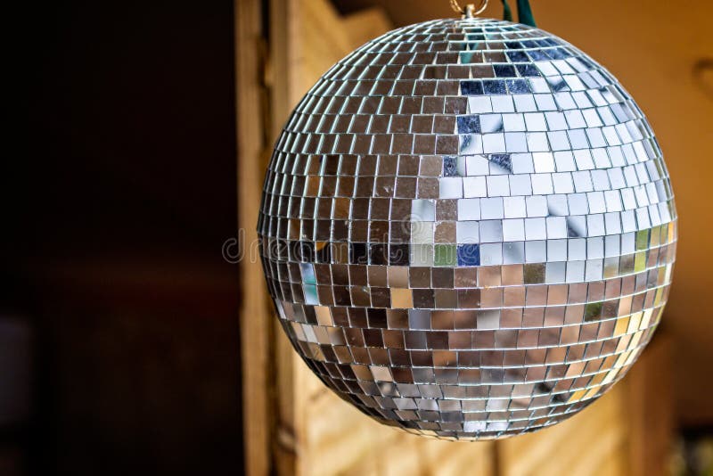 Close Up of a Silver Reflective Disco Ball Hanging Outside Stock Image ...