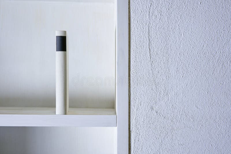 Close Up of Single Book Upright in White Shelf Stock Image - Image of ...