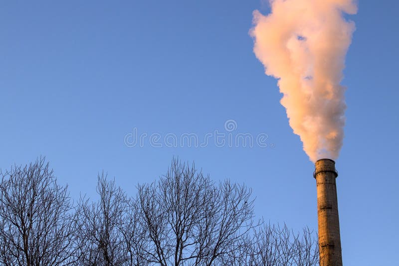 Close-up of a Single Concrete Smoke Stack Rising into the Dark Blue Sky ...