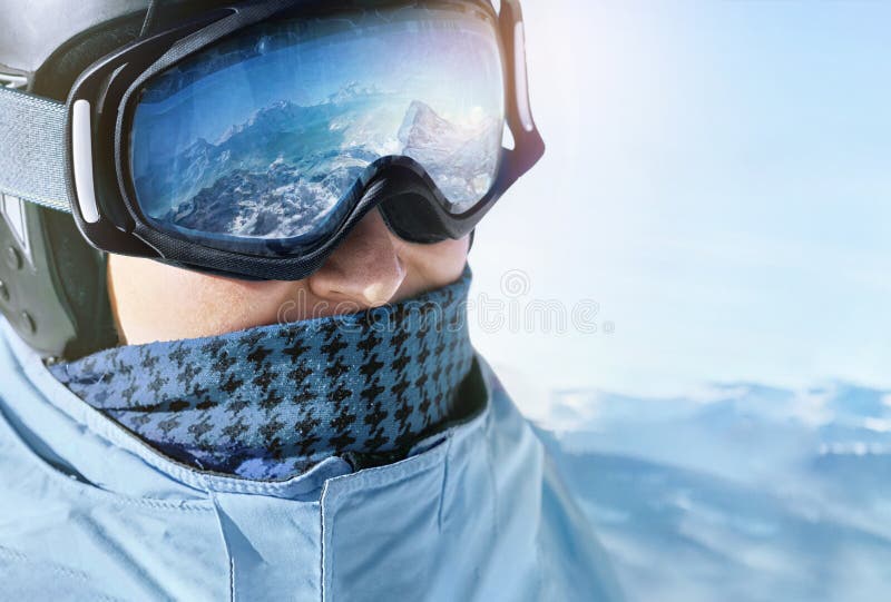 Close Up of the Ski Goggles of a Man with the Reflection of Snowed ...