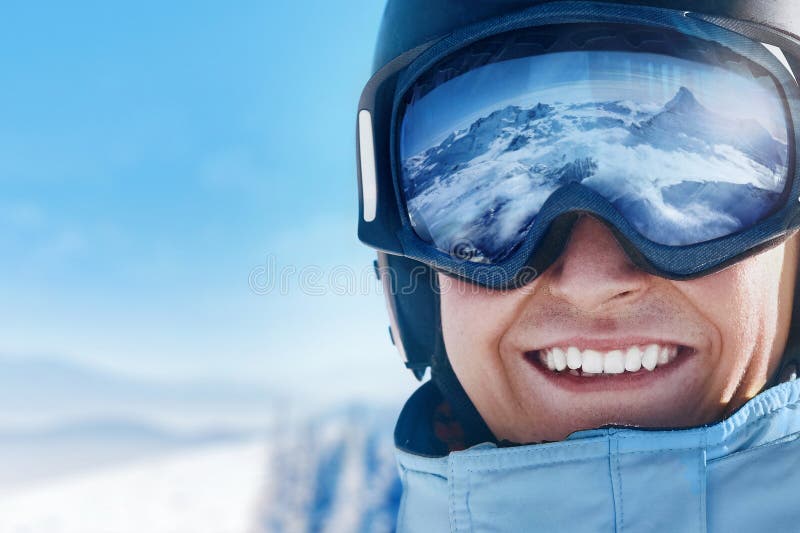 Close Up of the Ski Goggles of a Man with the Reflection of Snowed ...