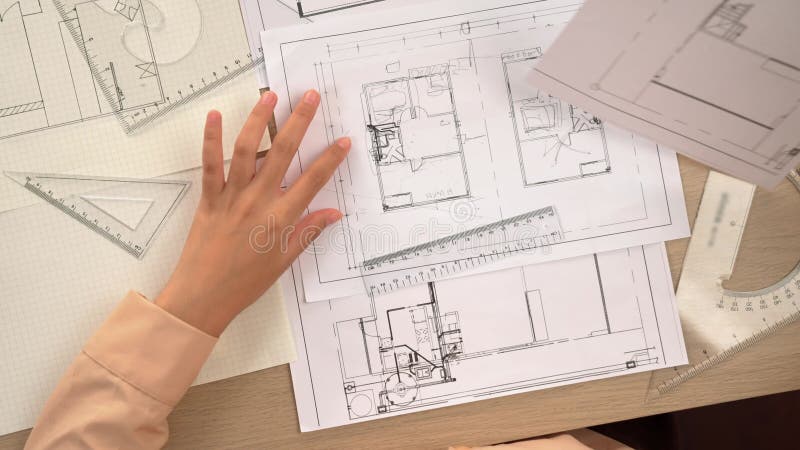Close Up of Skilled Architect Hand Comparing a Detail of Blueprint ...