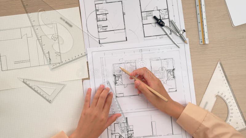 Close Up of Skilled Architect Hand Writing a Detail of Blueprint ...