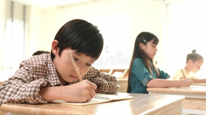 Close Up of Smart Asian Student Writing or Taking a Note during Test ...