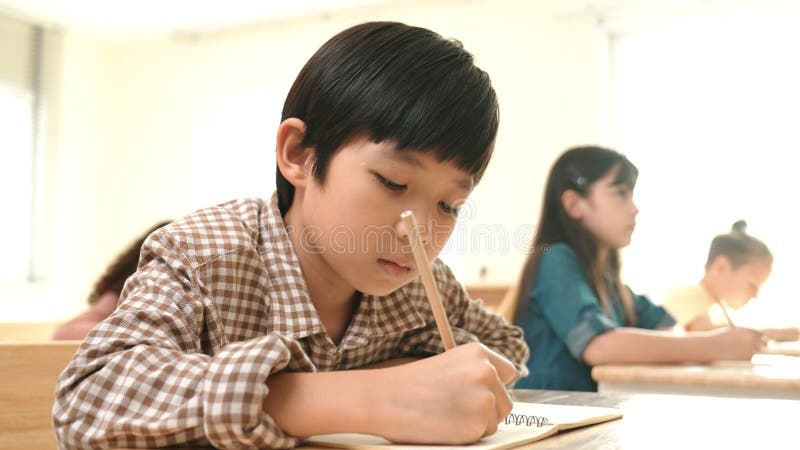 Close Up of Smart Asian Student Writing or Taking a Note during Test ...
