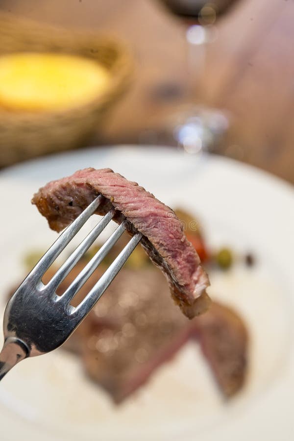 Slice of beef on fork stock photo. Image of meat, dish - 136355008
