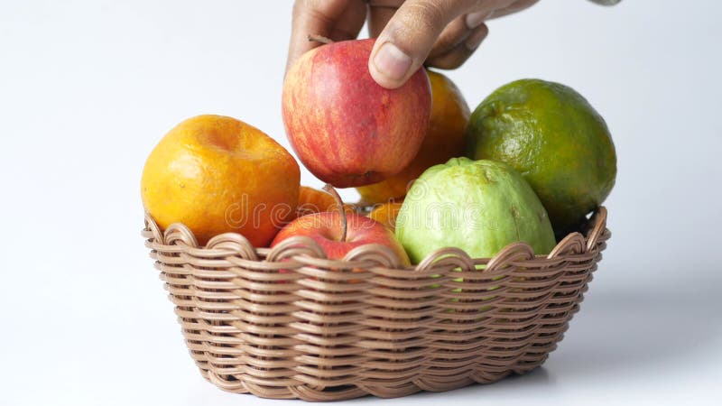 Hand Pick a Orange Fruit from a Bowl on Table Stock Video - Video of ...