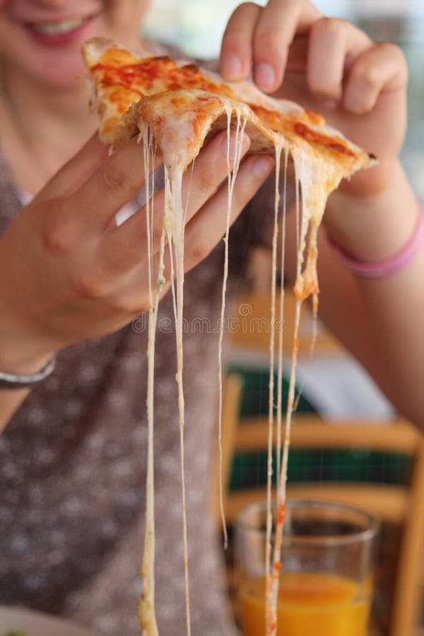 Slice of pizza in hands stock image. Image of fingernail - 148764759