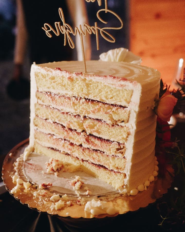 Close-up of a Sliced Layered Cake with Topper Stock Photo - Image of ...