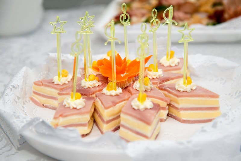 Close Up of Small Sweet Canapes Arranged on a Mirror Plate Over Light ...